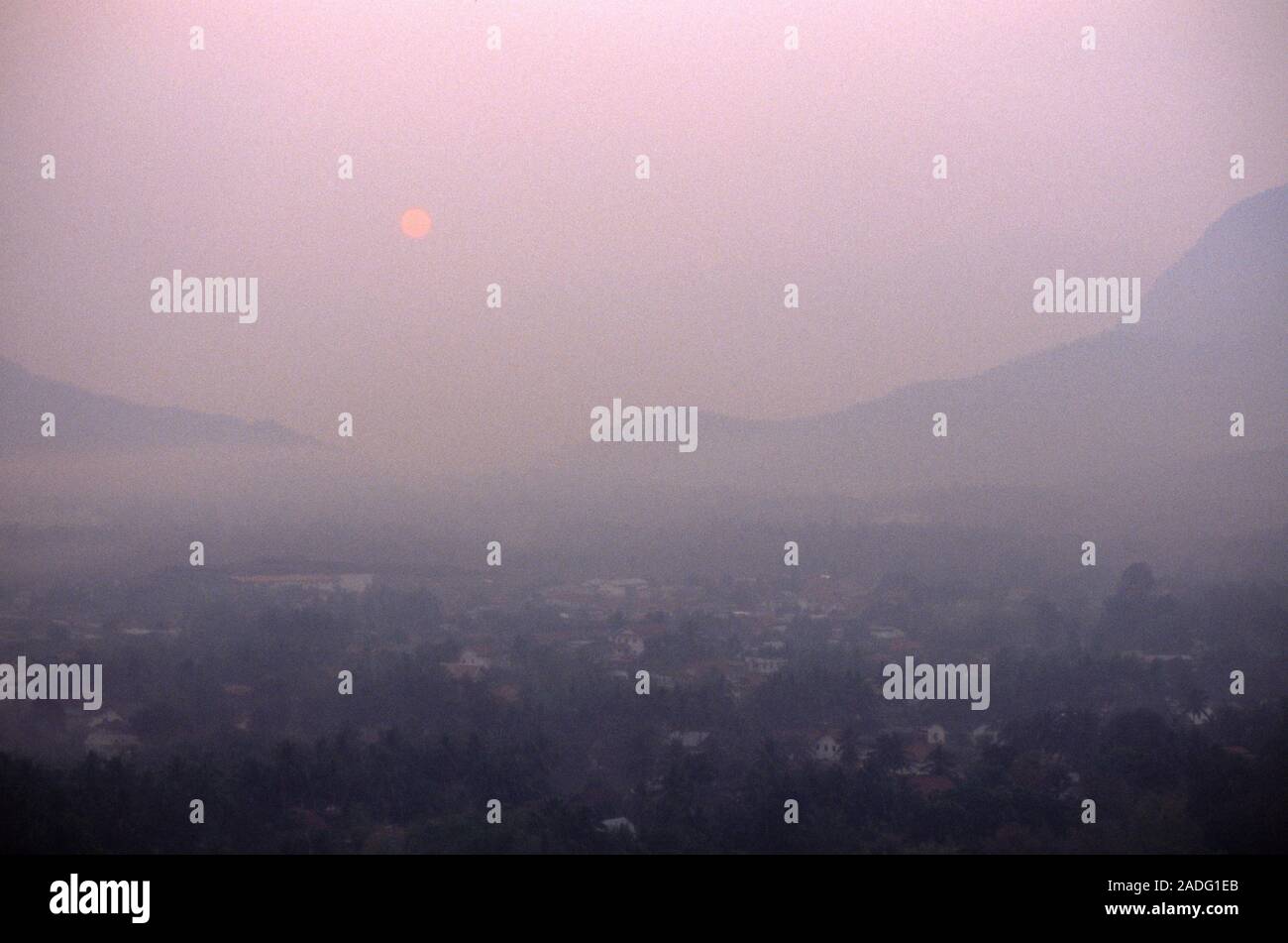 Air pollution. Haze of smoke in a populated valley. Photographed at ...