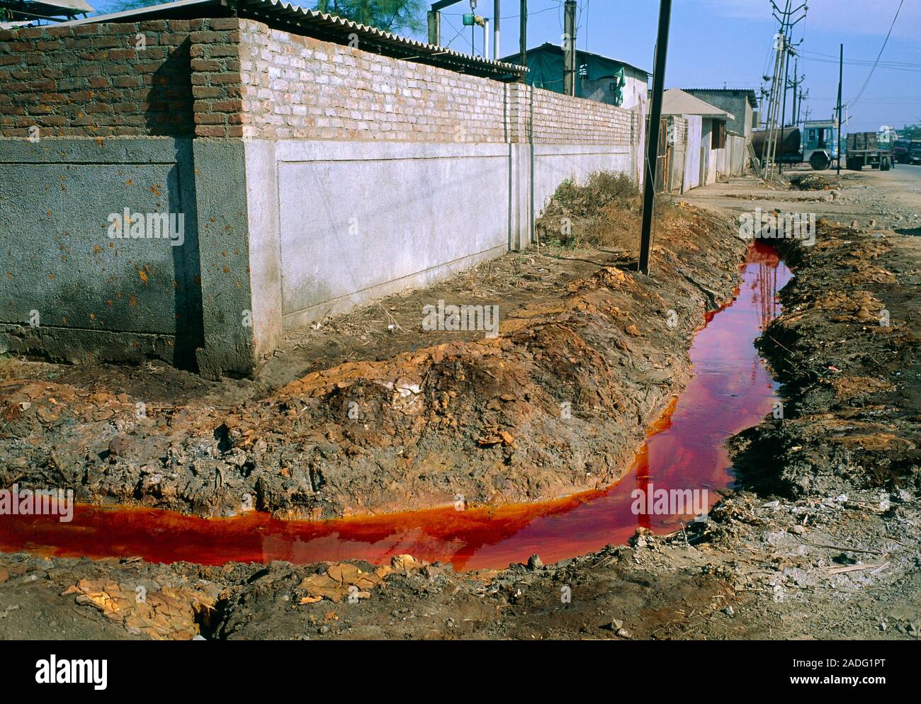 Water pollution. Polluted water in a street drainage ditch. The water ...
