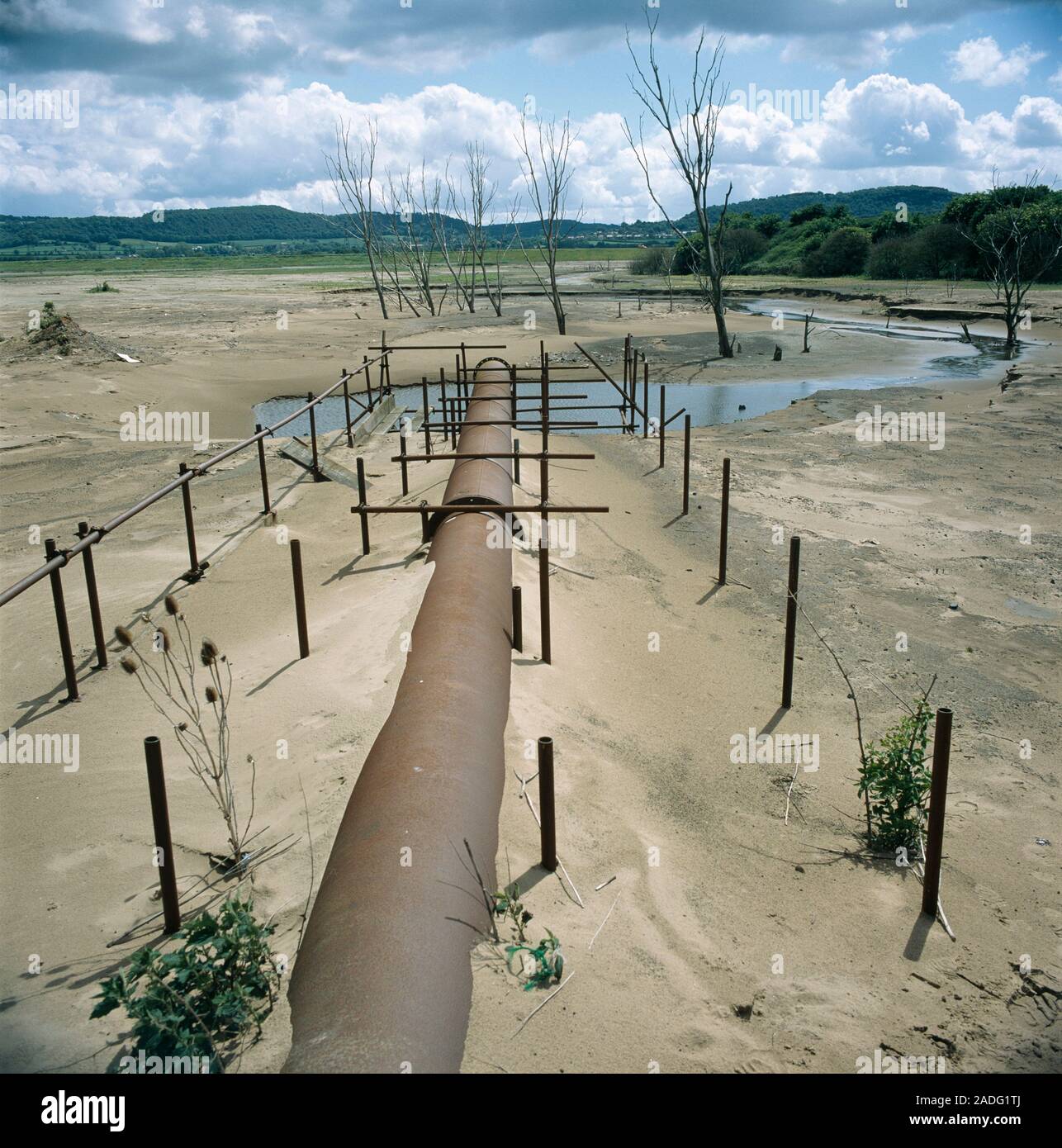 Contaminated waste. Pipe dumping silt dredged from the Manchester Ship ...