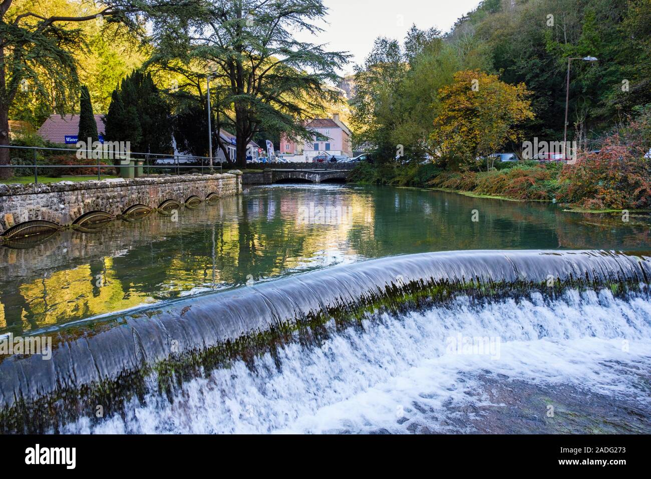 The Mill pond with water flowing over one of the dams on Cheddar Yeo ...