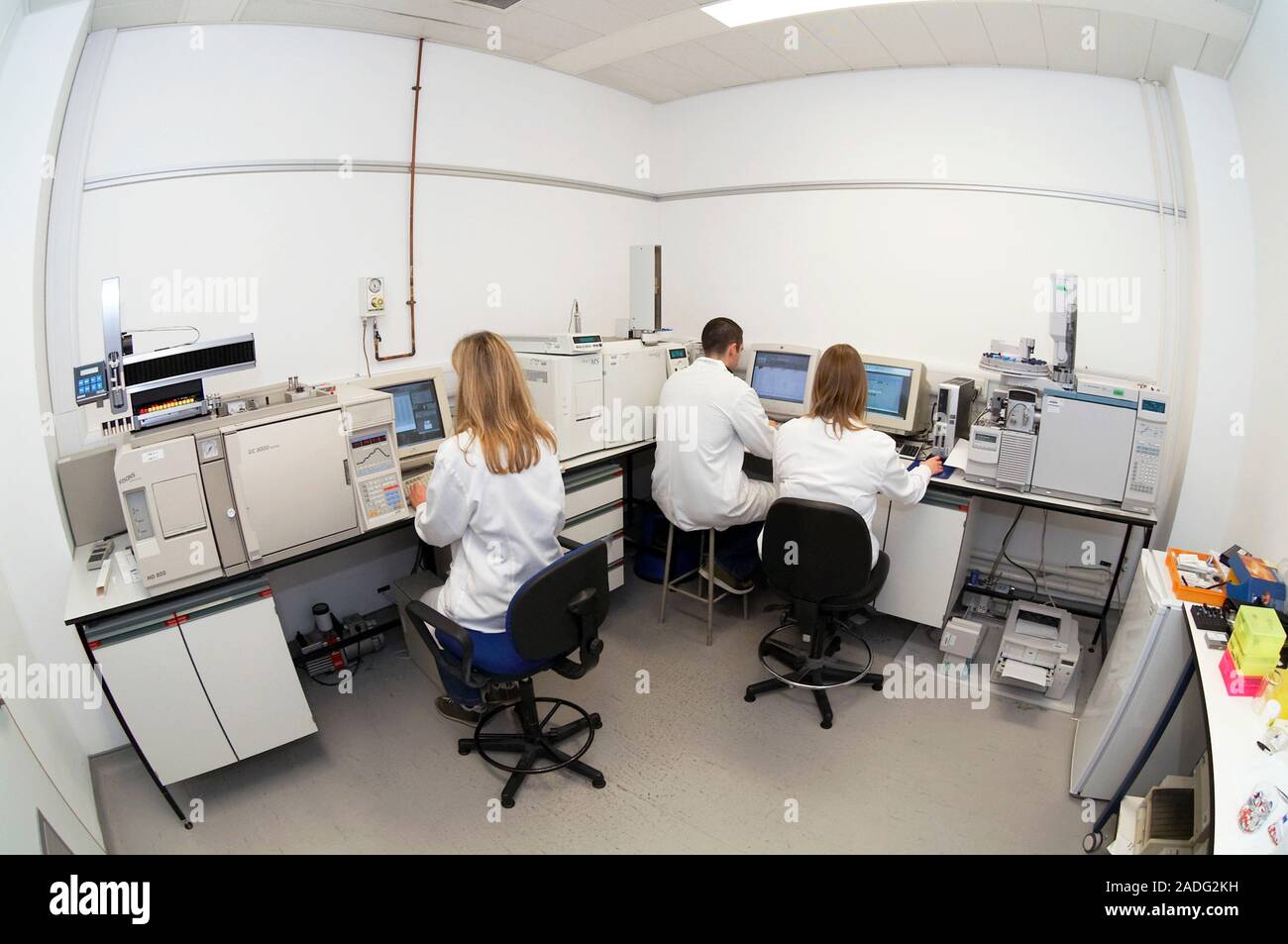 Pollution monitoring. Chemists in an environmental pollution research ...