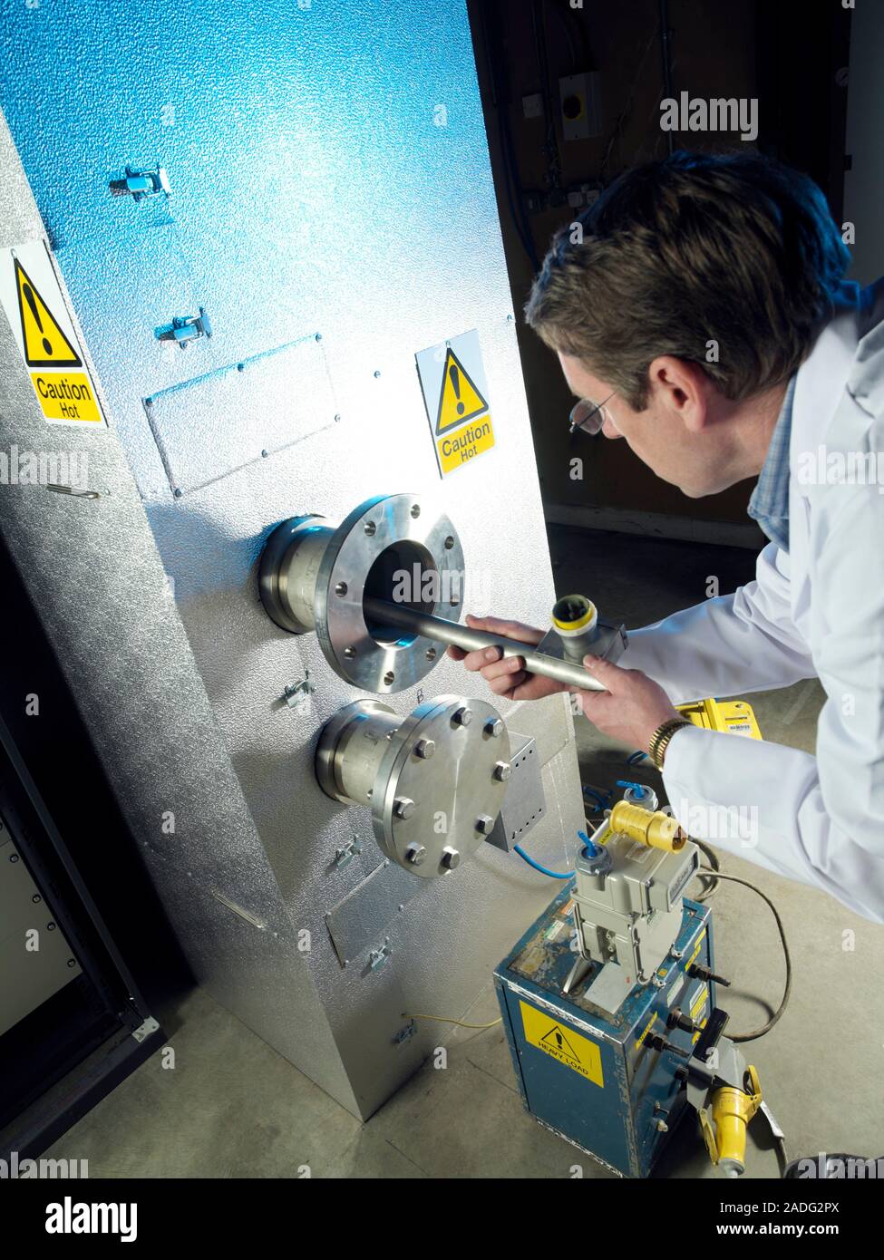 Chimney stack simulator. Researcher sampling gases from the stack ...