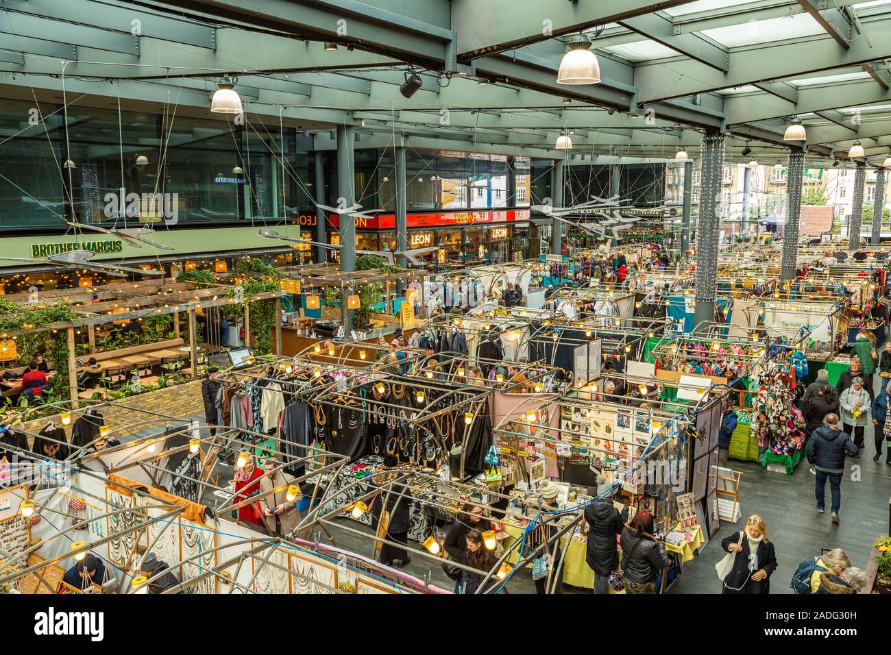 Old Spitalfields Market on a busy Sunday afternoon with stallholders ...