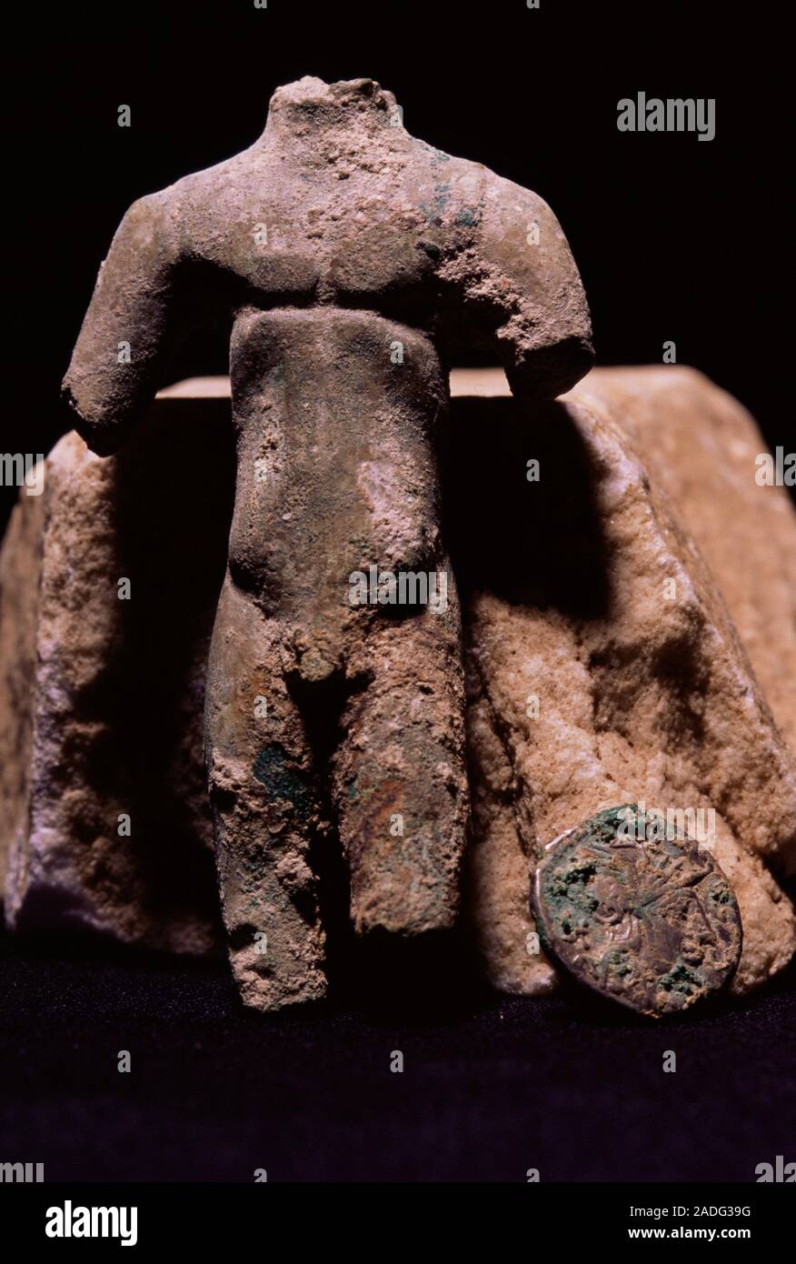 Roman statue and coin. Small statues were often used by the Romans as ...