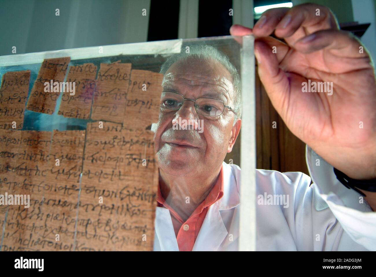 Egyptian papyrus conservation. Italian papyrologist Corrado Basile ...