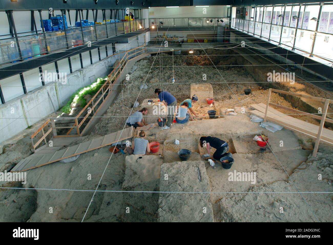 Excavation of a prehistoric site. Archaeologists excavating the ...