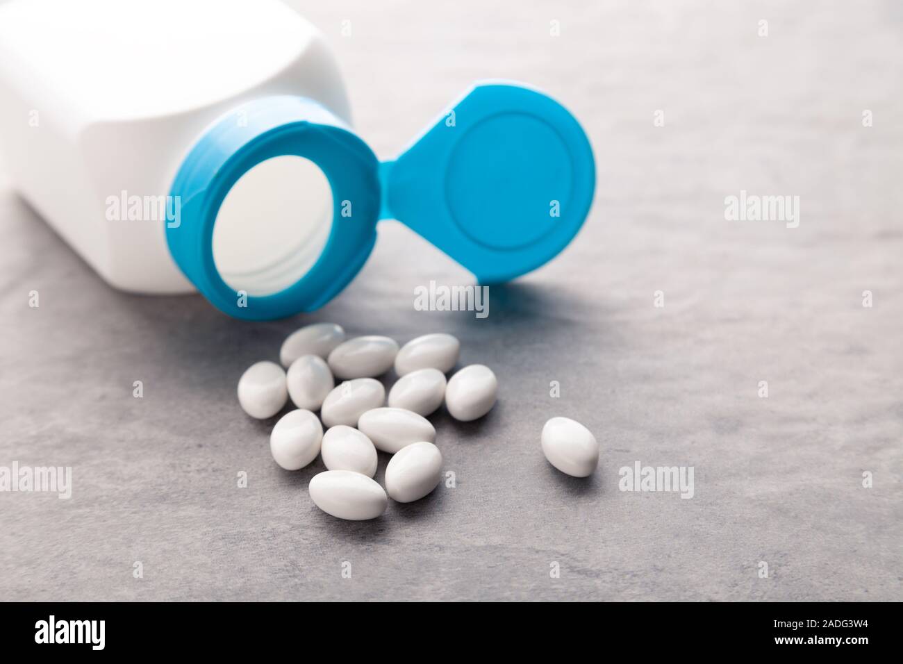 Pharmaceutical medicine tablets, pills, capsules, drugs on grey ...