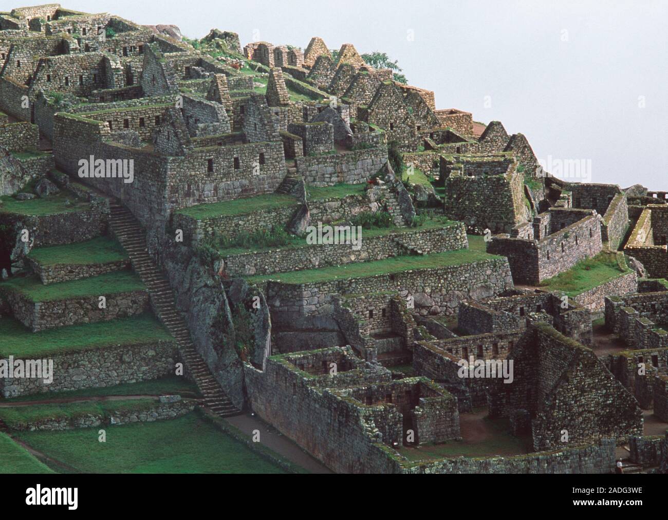 Machu Picchu ruins on a ridge high in the Andes mountains. Machu Picchu ...