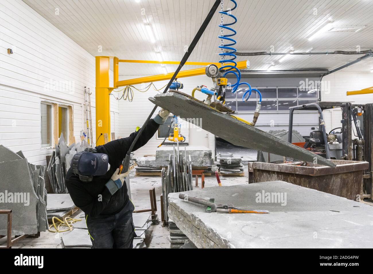 Male working with slates, flat rock, flat stone, from quarry in Pæska ...