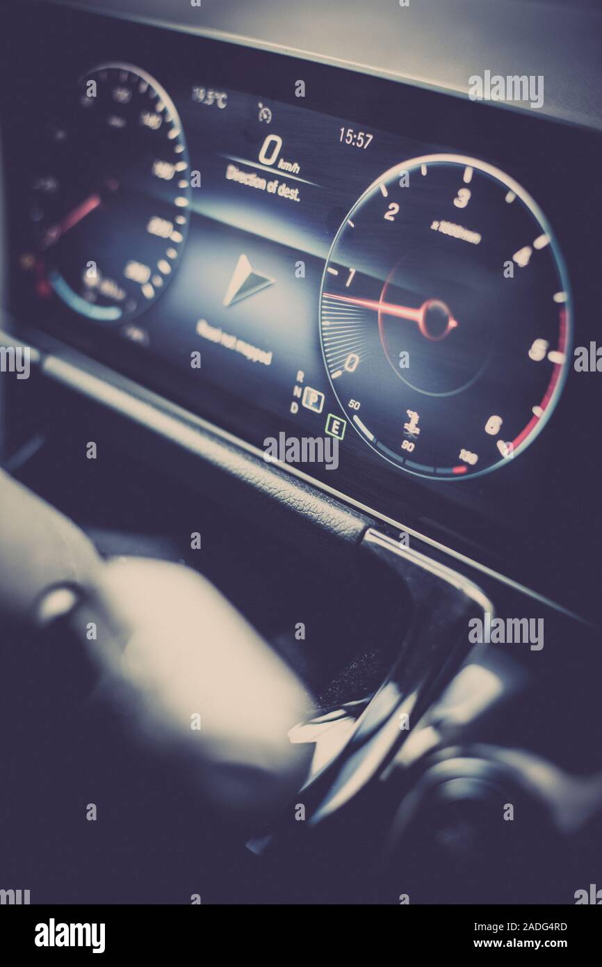 Close up shot with the digital tachometer on a modern car dashboard ...