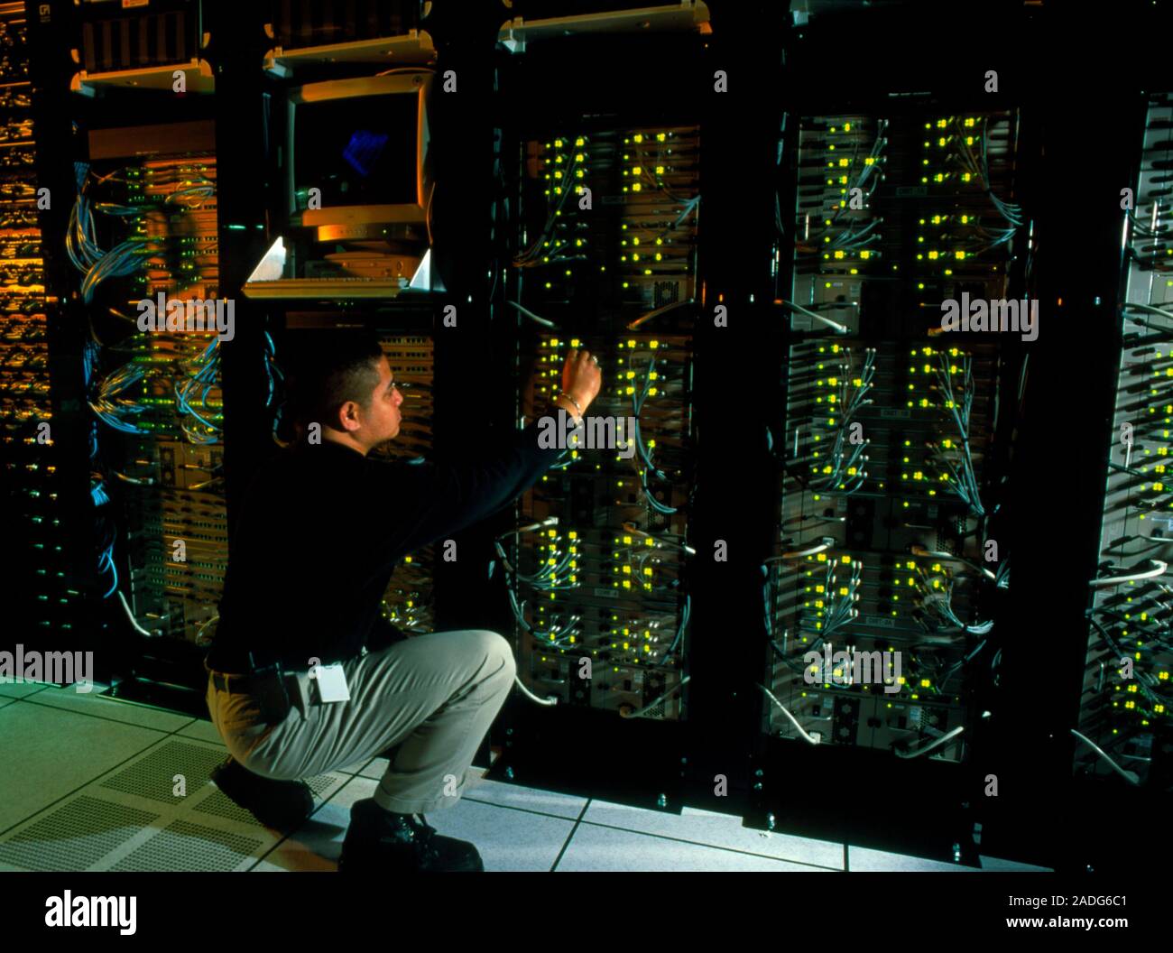 DNA sequencing supercomputers. Technician with supercomputers used in ...