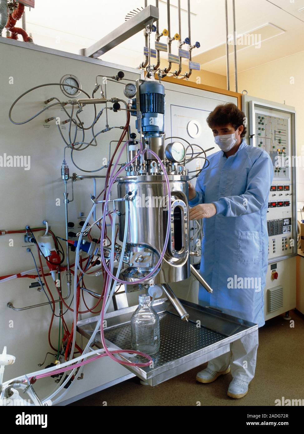 Fermentation unit. Technician working at a fermentation unit, or ...