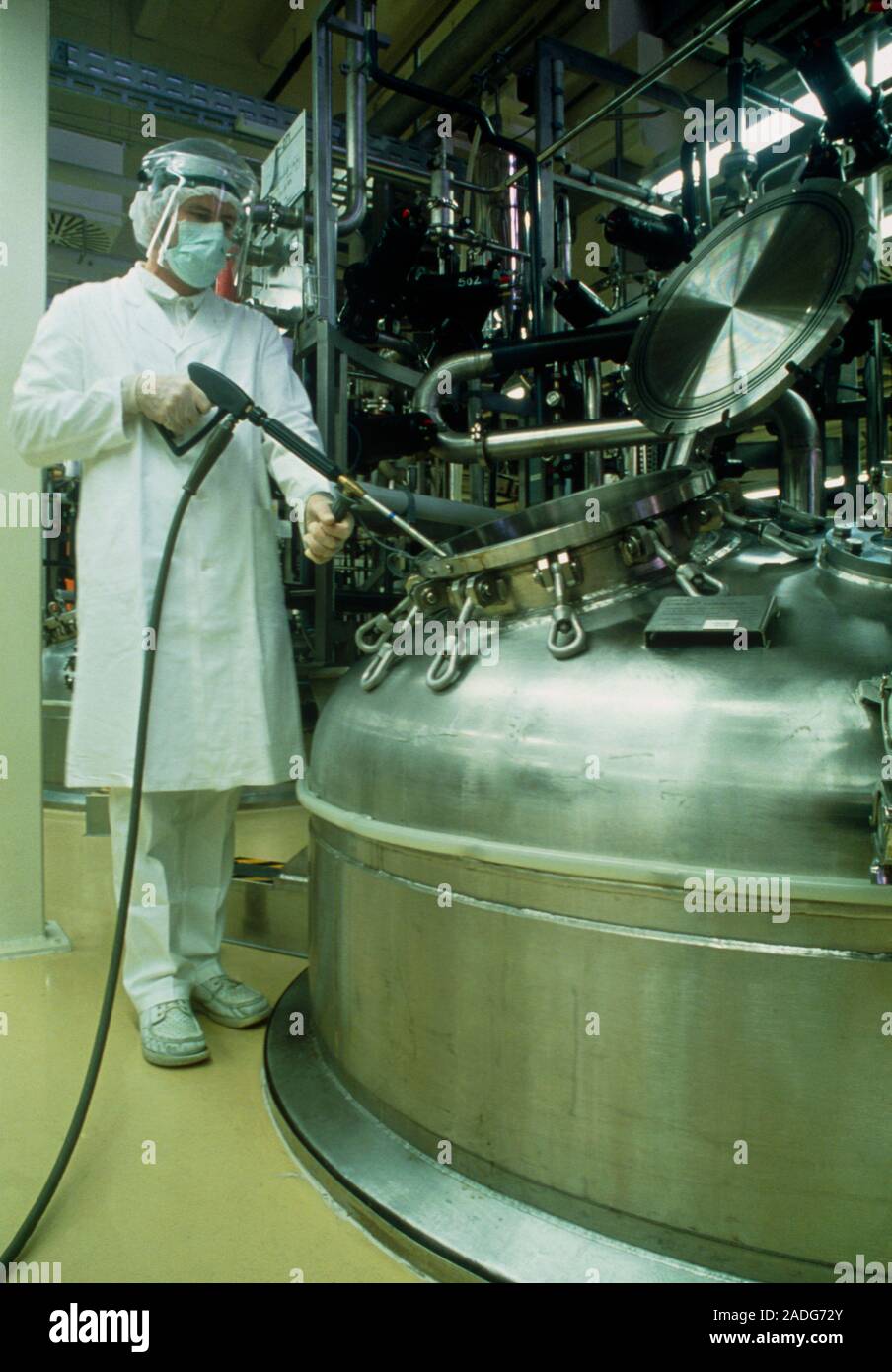 POSED BY MODEL. Fermentation unit. Pharmaceutical technician in clean ...