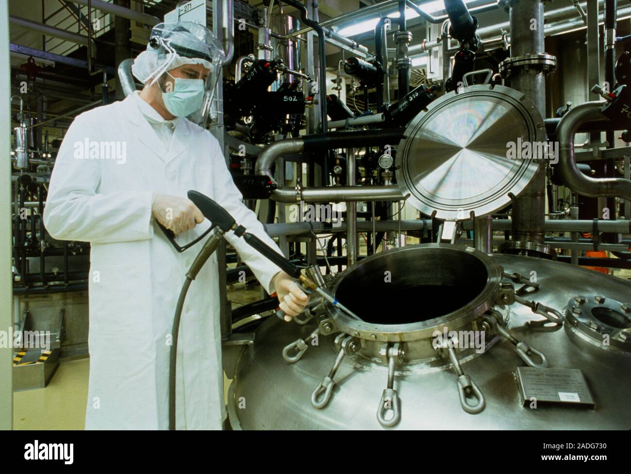 POSED BY MODEL. Fermentation unit. Pharmaceutical technician in clean ...
