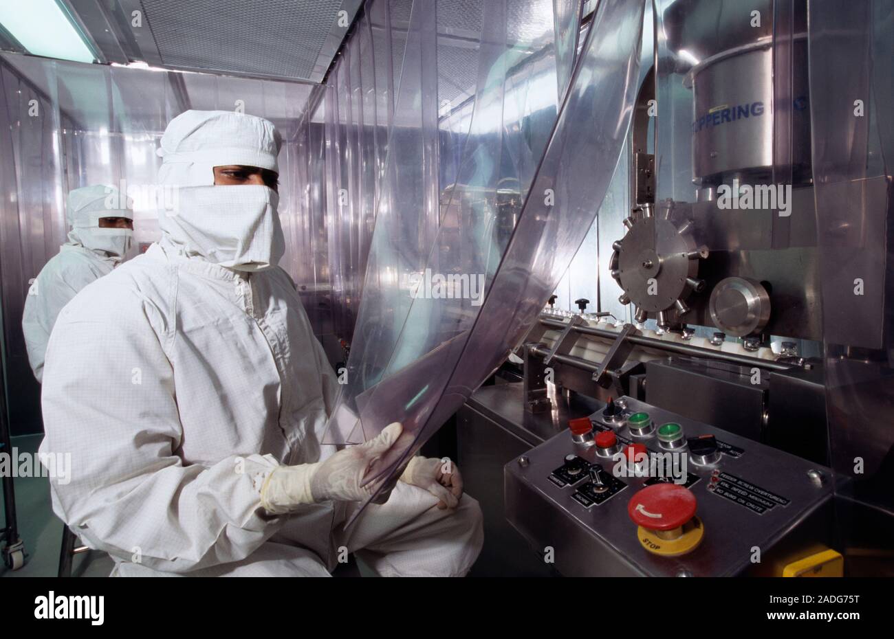 DNA vaccine production. Technicians working with genetically modified ...