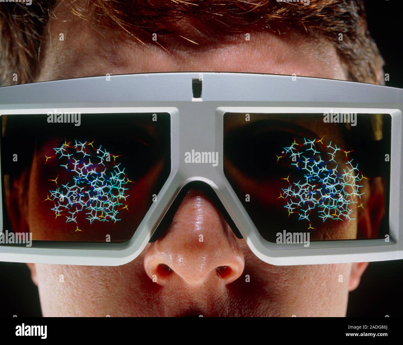 MODEL RELEASED: Stereo computer glasses. A researcher wearing Stereo ...