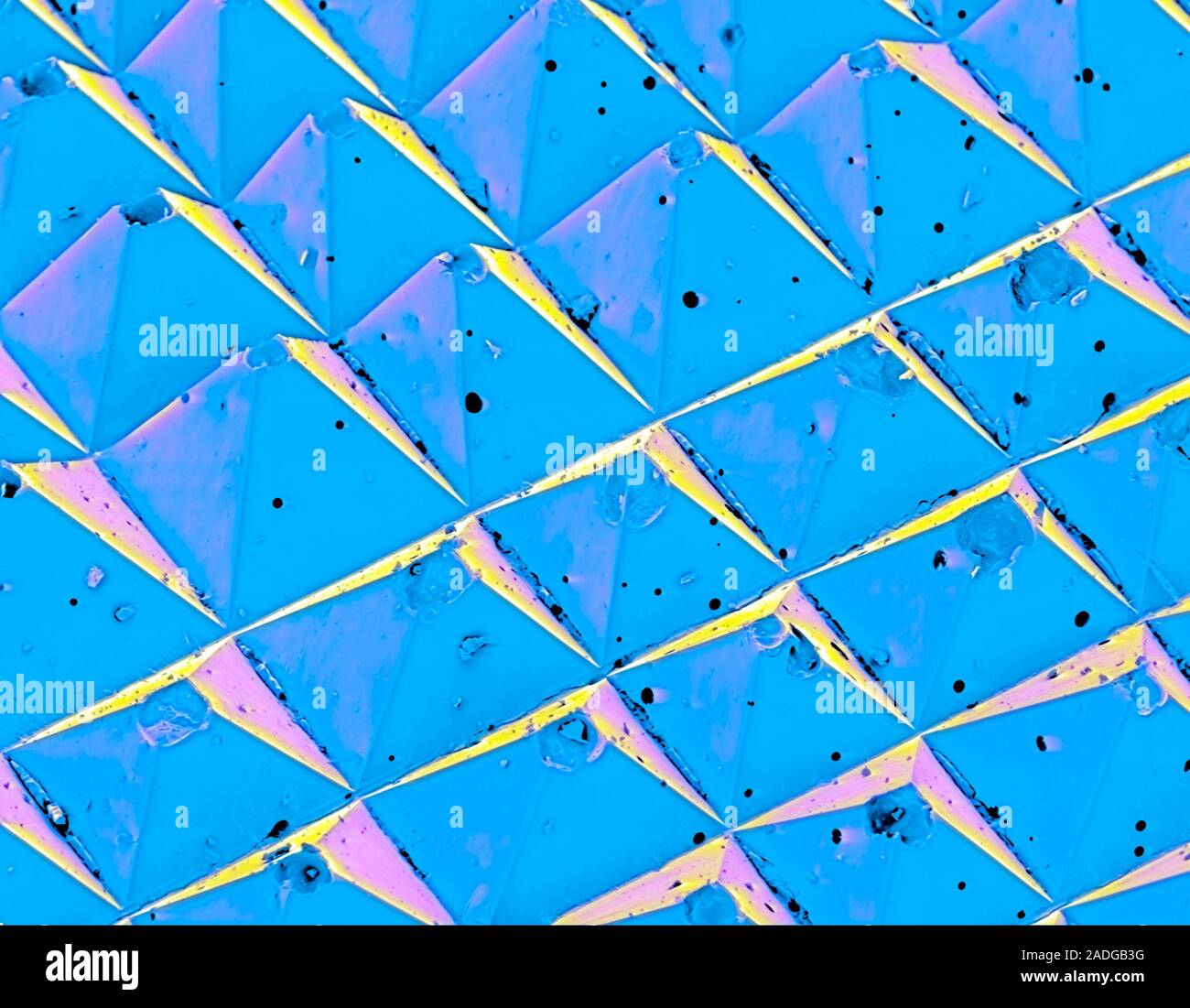 Sandpaper. Coloured scanning electron micrograph (SEM) of the surface ...