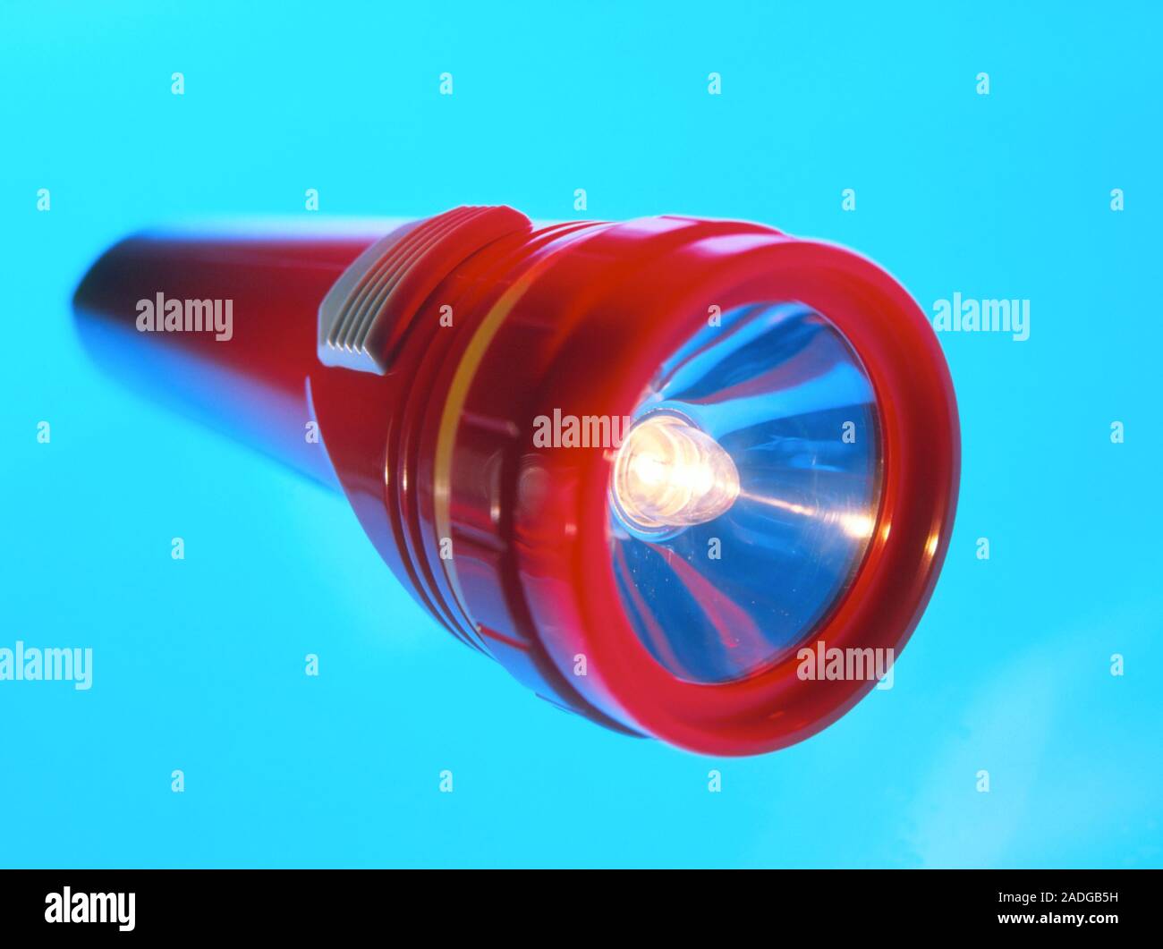 Torch. Hand-held torch switched on Stock Photo - Alamy