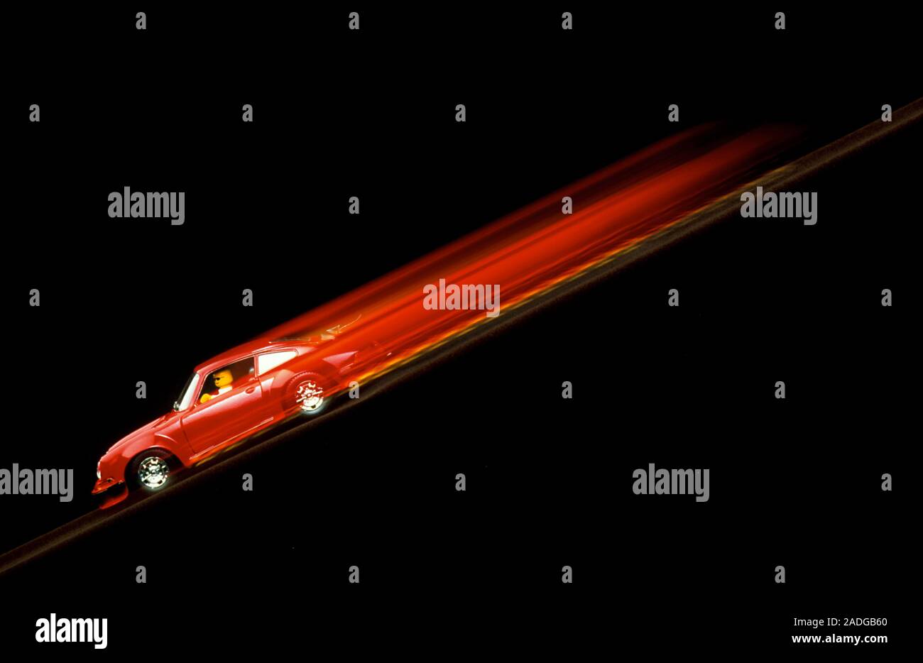 Toy car. Time exposure image of a toy car descending a ramp. Raising ...