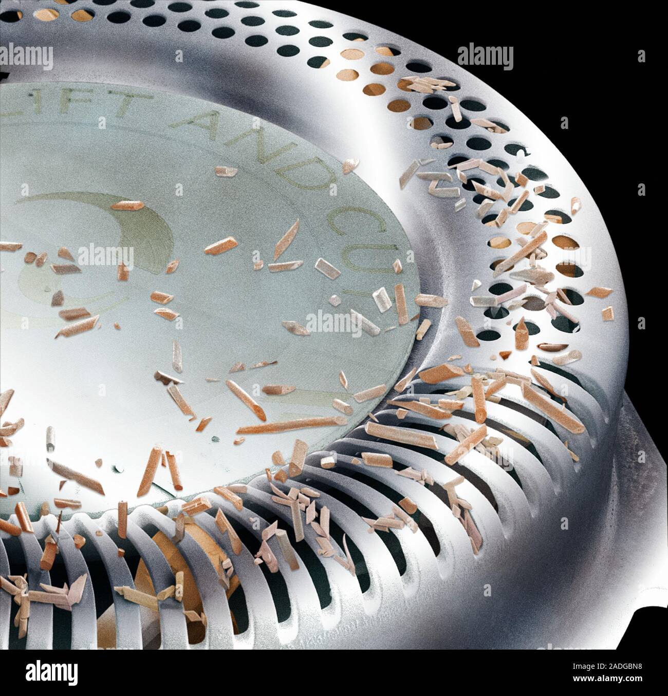 Electric razor with cut stubble (brown), coloured scanning electron ...