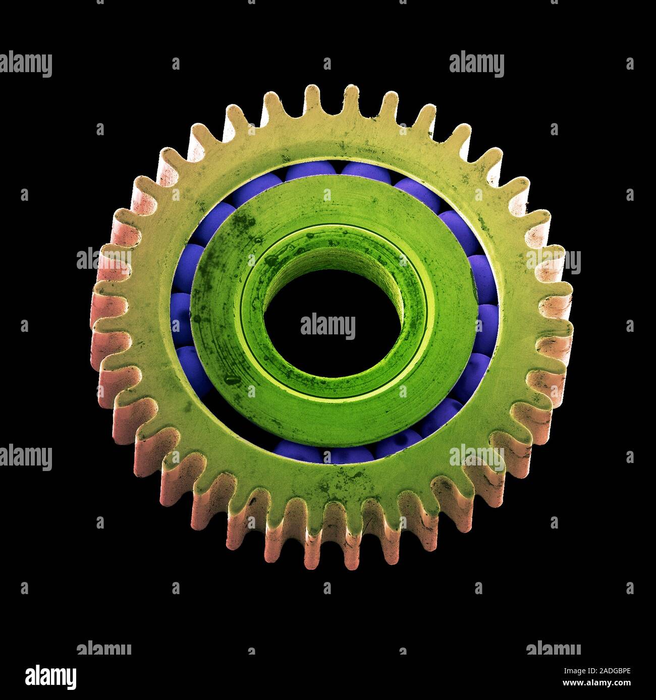 Watch cog, coloured scanning electron micrograph (SEM Stock Photo - Alamy
