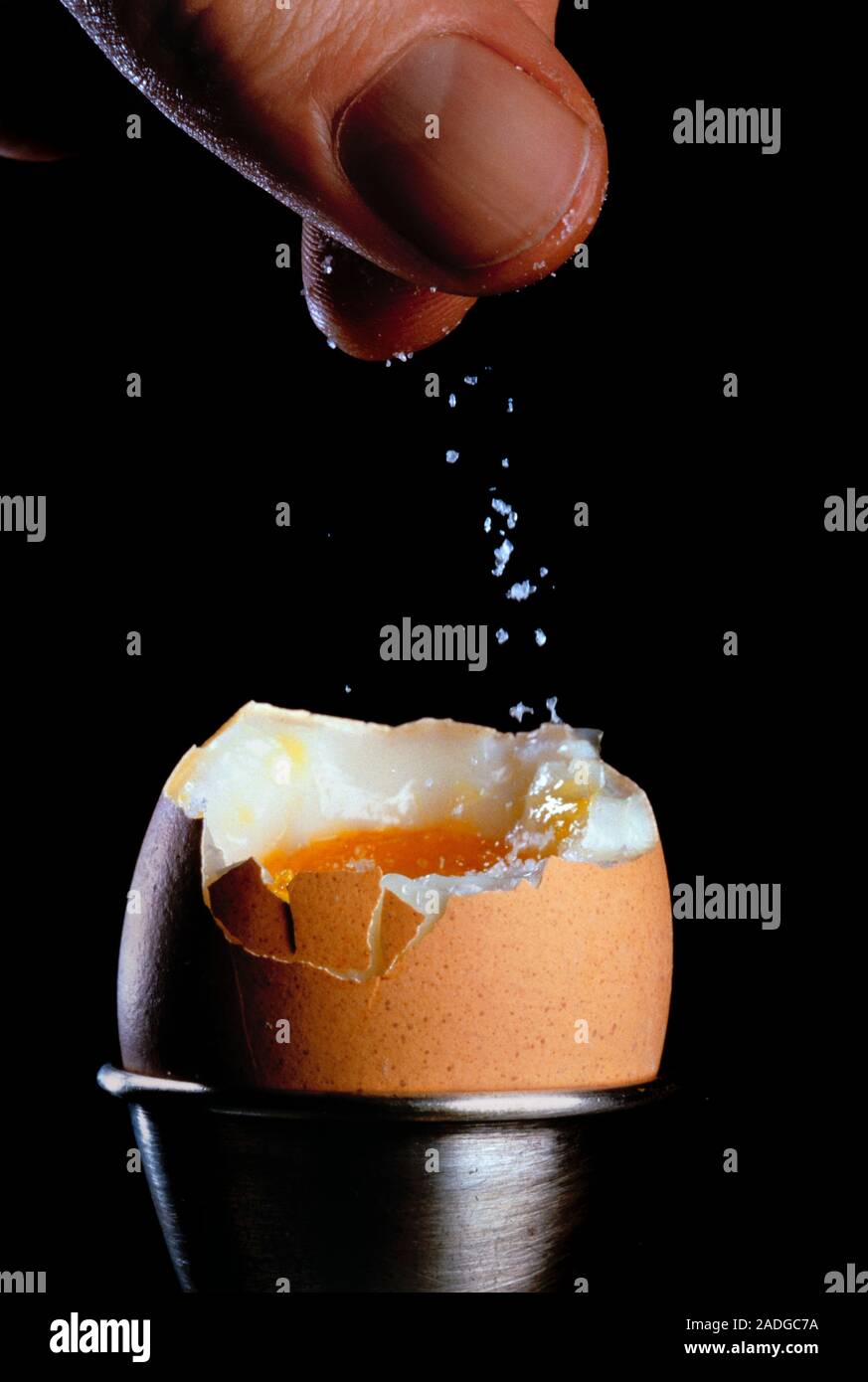 Pinch of salt (sodium chloride) added to a boiled egg. Sodium is an ...