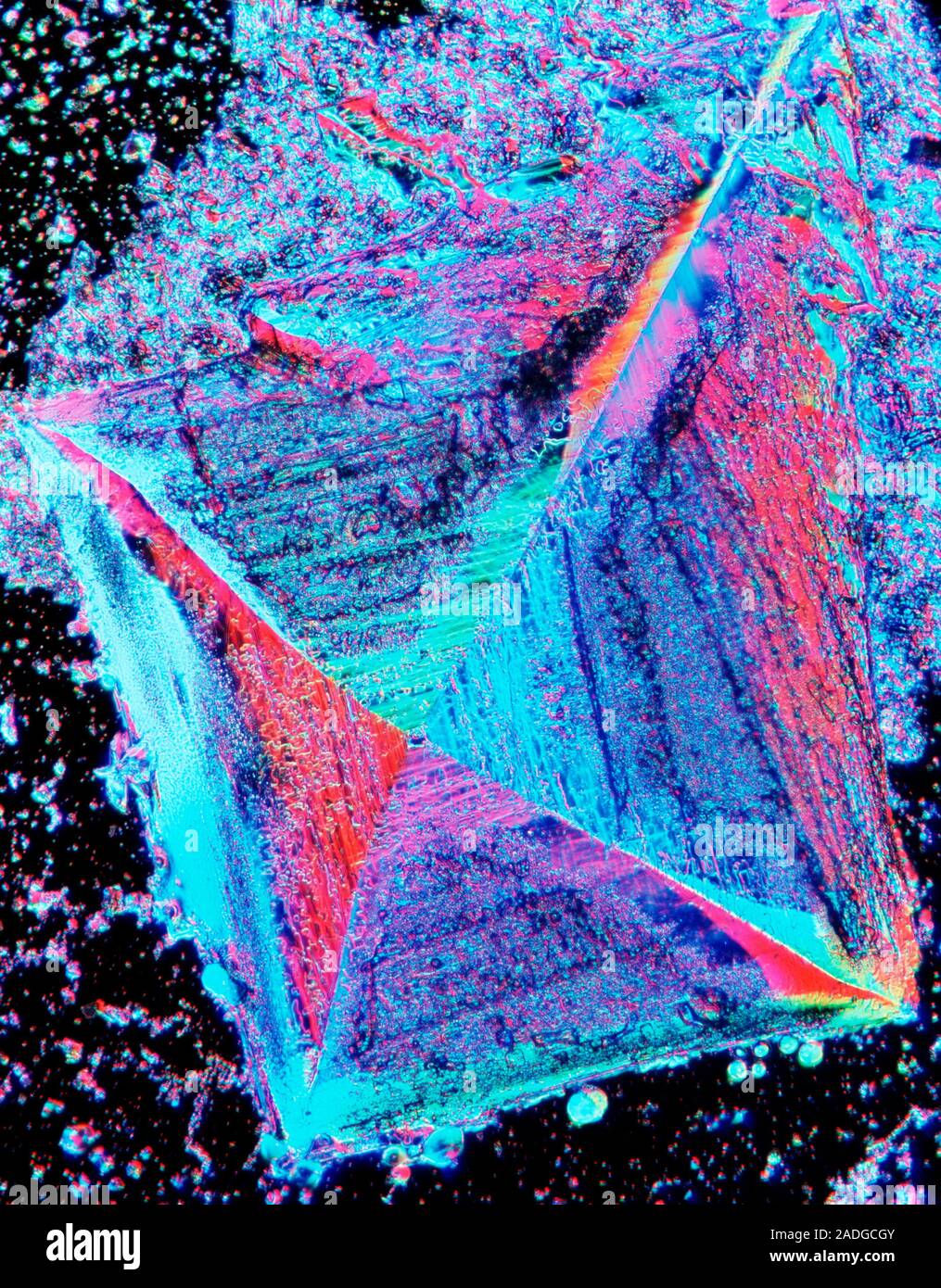 Salt. Polarised light micrograph of a crystal of sodium chloride, the ...