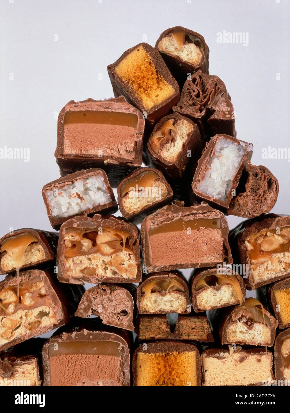 Chocolate bars. Assortment of sliced chocolate bars. Junk food like ...