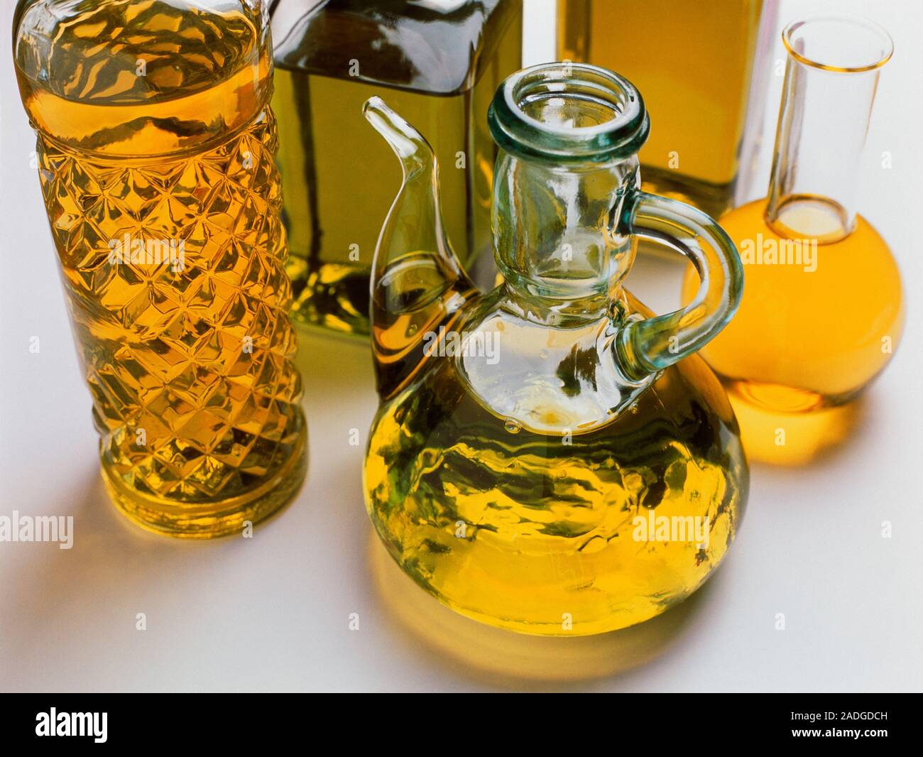 Olive oil. Bottles of oil squeezed from olives (Olea europaea Stock ...