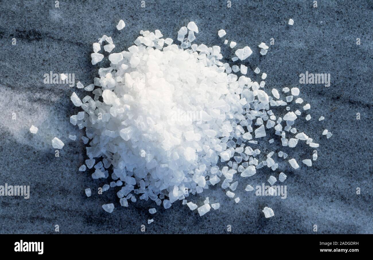 Sea salt. Pile of coarse grains of sea salt. Salt (sodium chloride) is ...