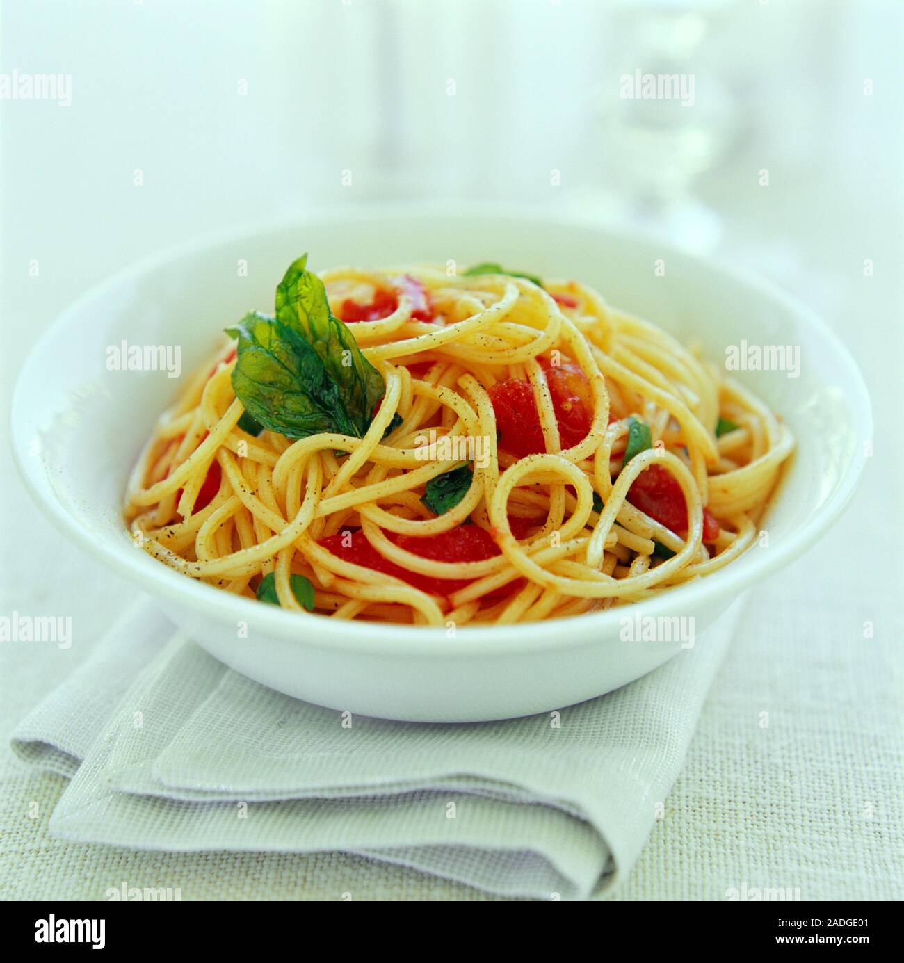 Spaghetti served in a bowl. Spaghetti is a type of pasta made into long ...