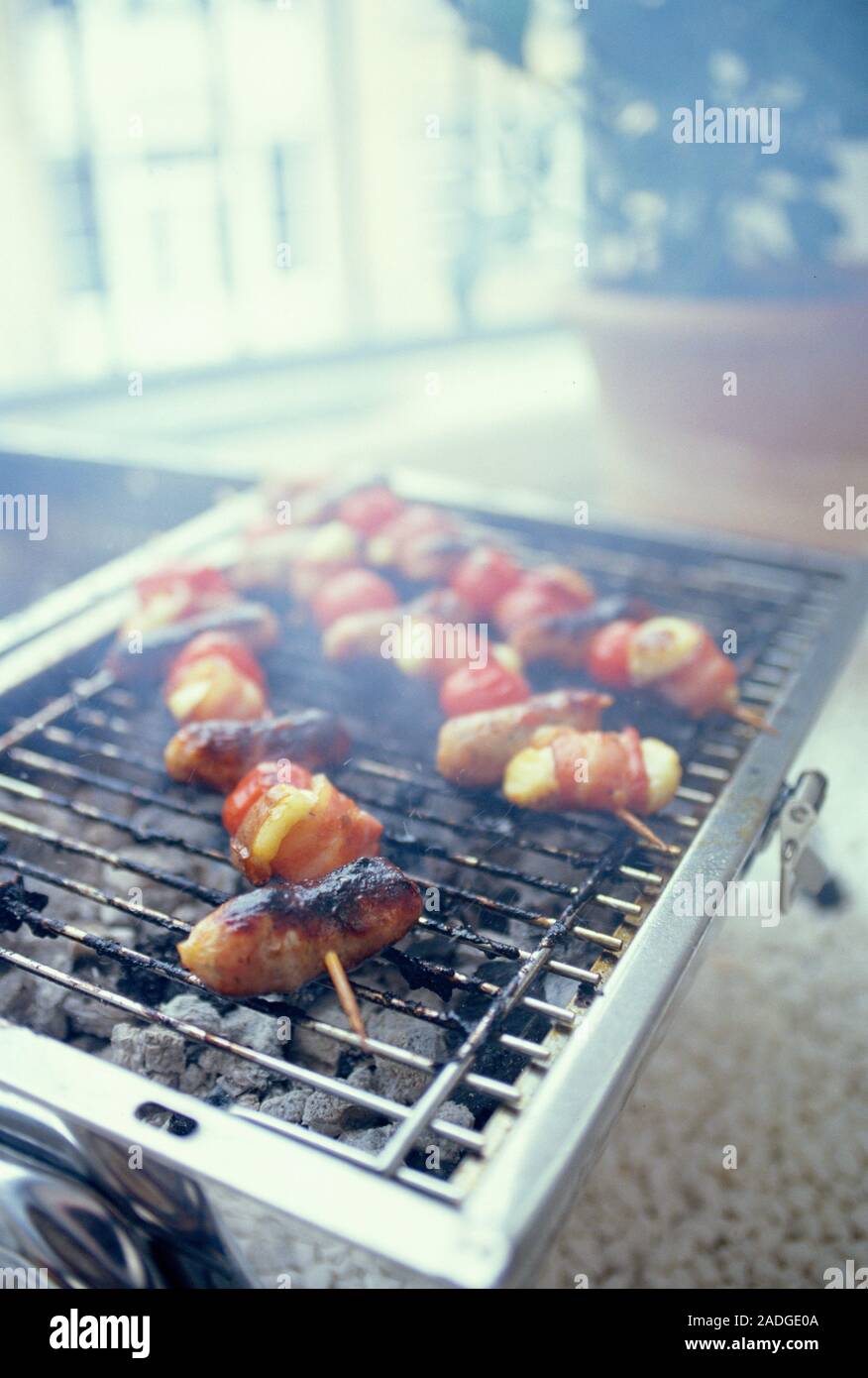 Barbecue. Meat being grilled on a barbecue. It is important to cook ...