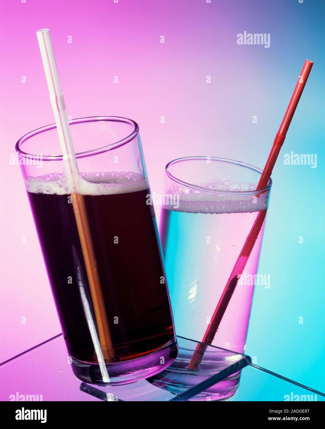 Fizzy drinks. Glasses containing carbonated soft drinks. These contain ...