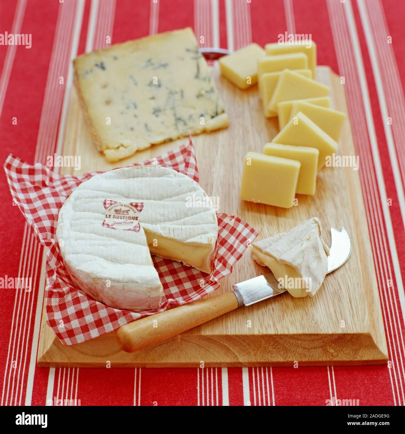 Cheese selection, including Stilton (upper left), Cheddar (upper right ...