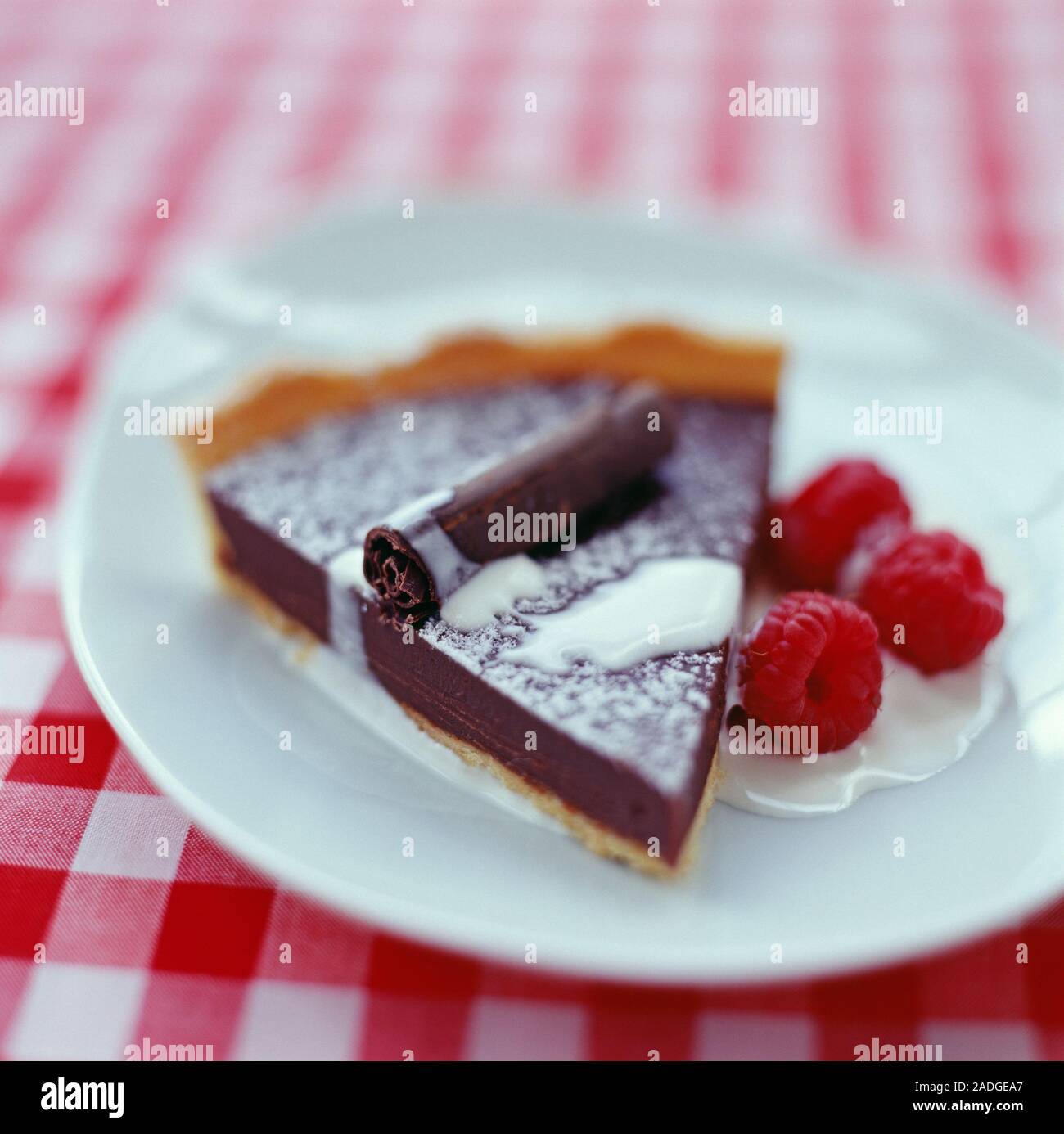 Chocolate tart slice with raspberries and cream Stock Photo - Alamy