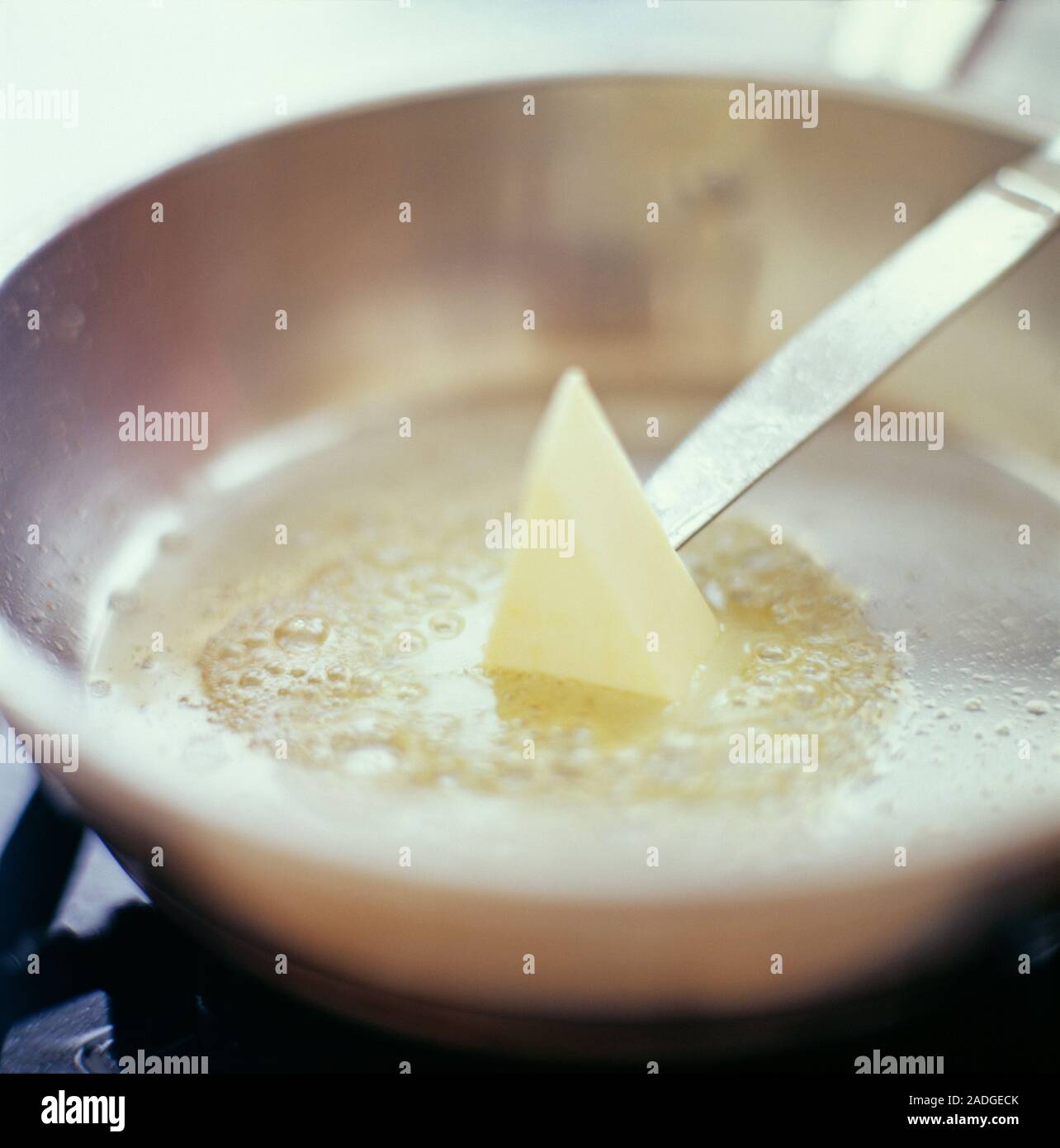 Melting butter in a pan Stock Photo - Alamy