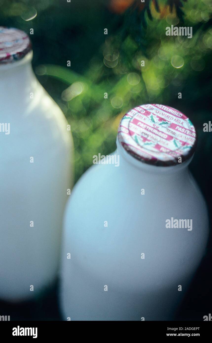 Milk bottles. Two milk bottles containing semi- skimmed milk Stock ...