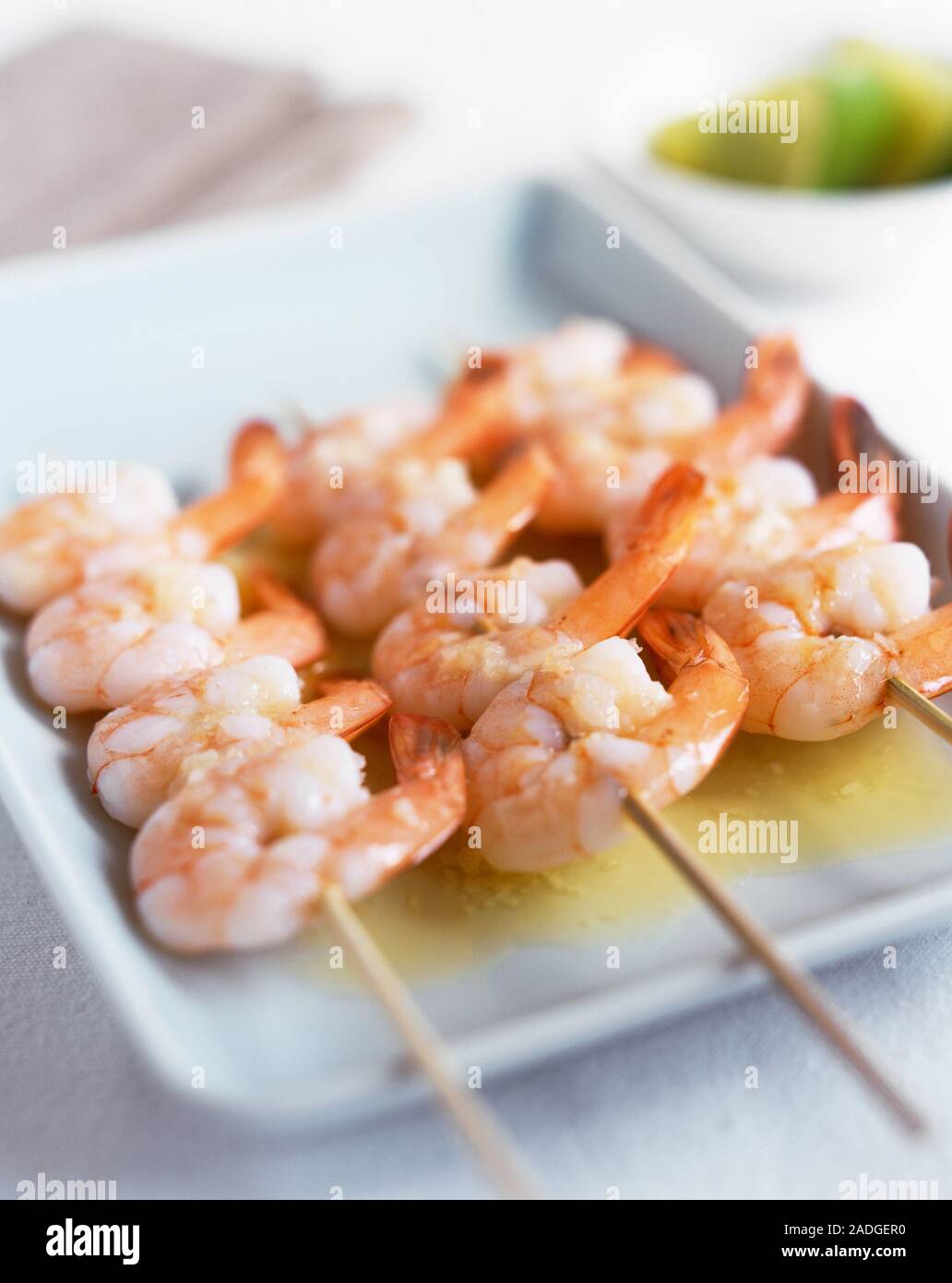 Prawns. Cooked peeled prawns on wooden skewers. Prawns are a good ...