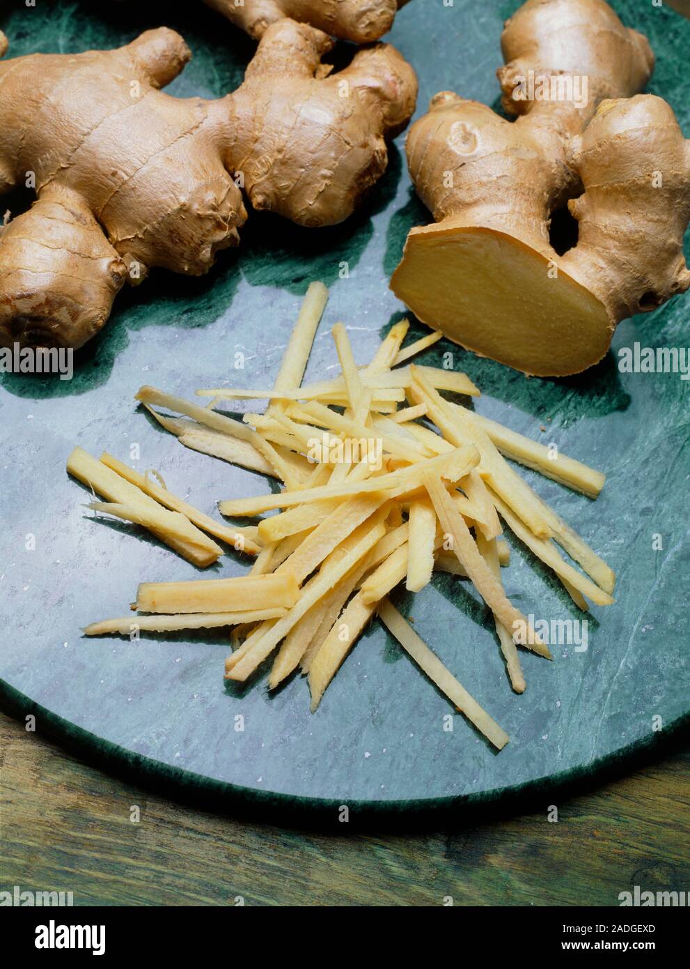 Zingiber officinale. Common Ginger cut in strips on a plate. This ...
