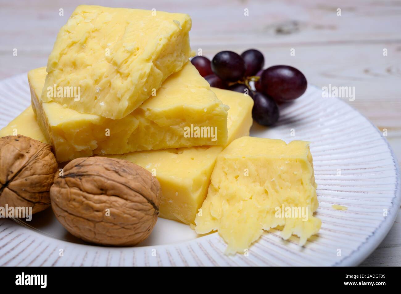 Cheese collection, blocks of matured english cheddar cheese close up ...