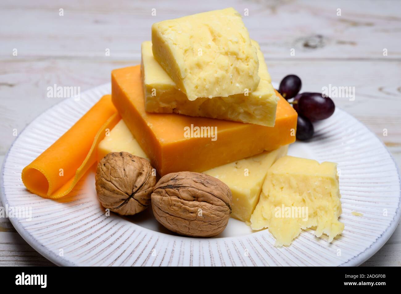 Cheese collection, blocks and slices of yellow and matures english ...