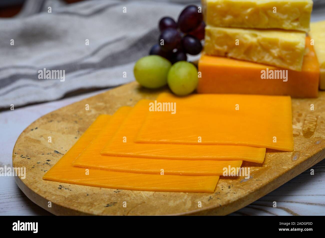 Cheese collection, blocks and slices of yellow and matures english ...