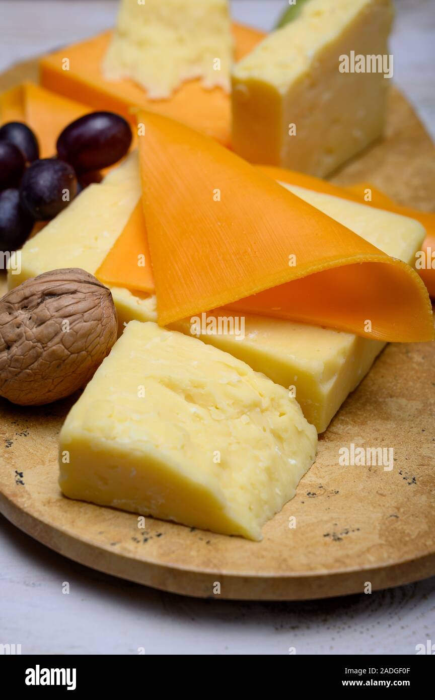 Cheese collection, blocks and slices of yellow and matures english ...
