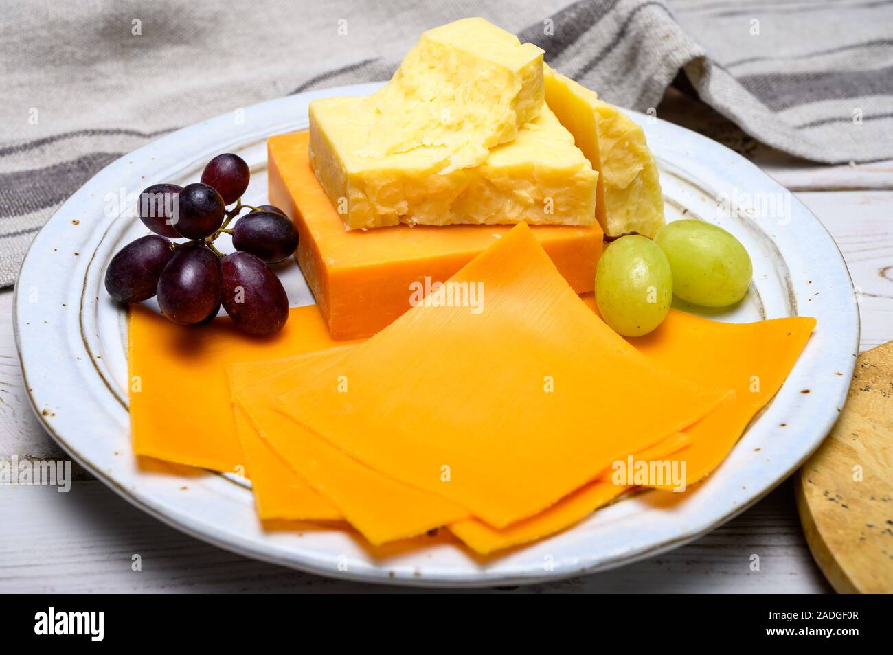 Cheese collection, blocks and slices of yellow and matures english ...