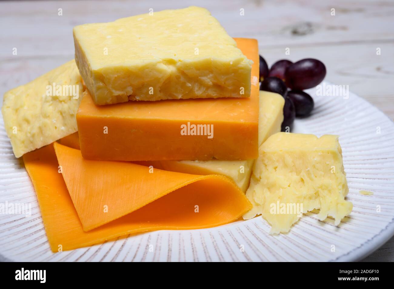 Cheese collection, blocks and slices of yellow and matures english ...