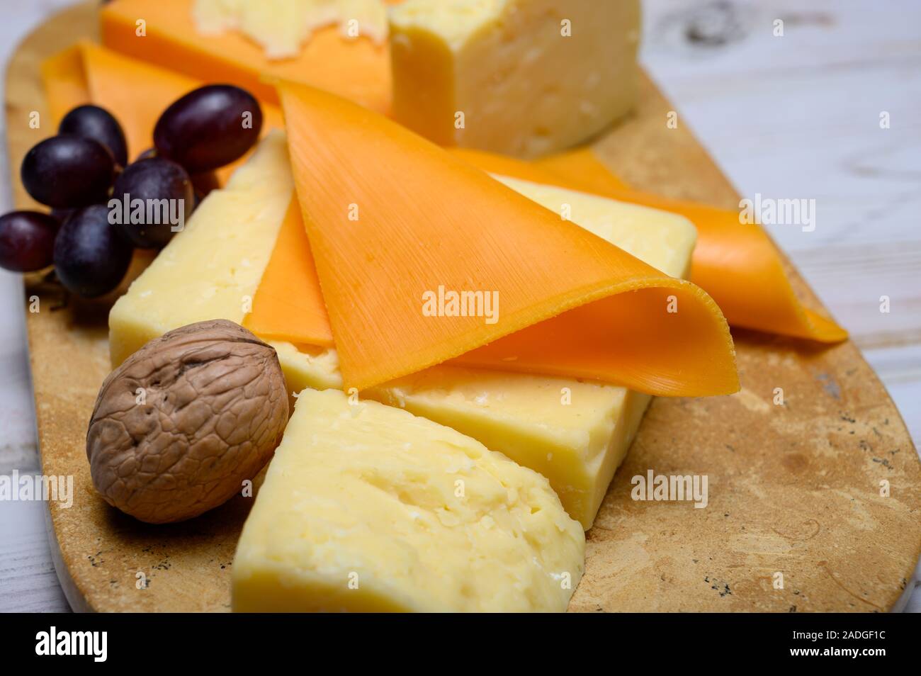 Cheese collection, blocks and slices of yellow and matures english ...