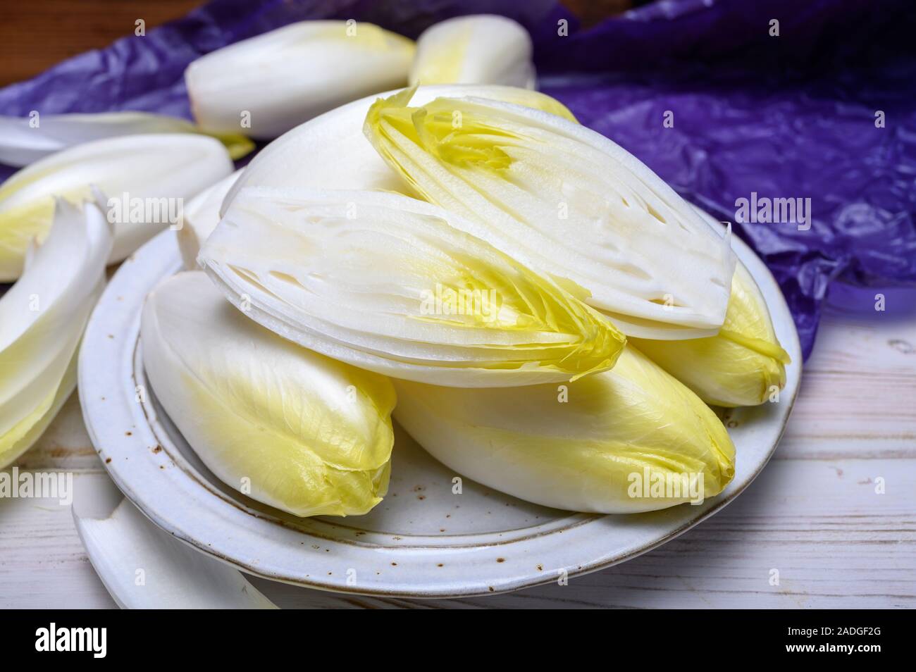 Fresh white belgian endive or chicory salad heads close up Stock Photo ...