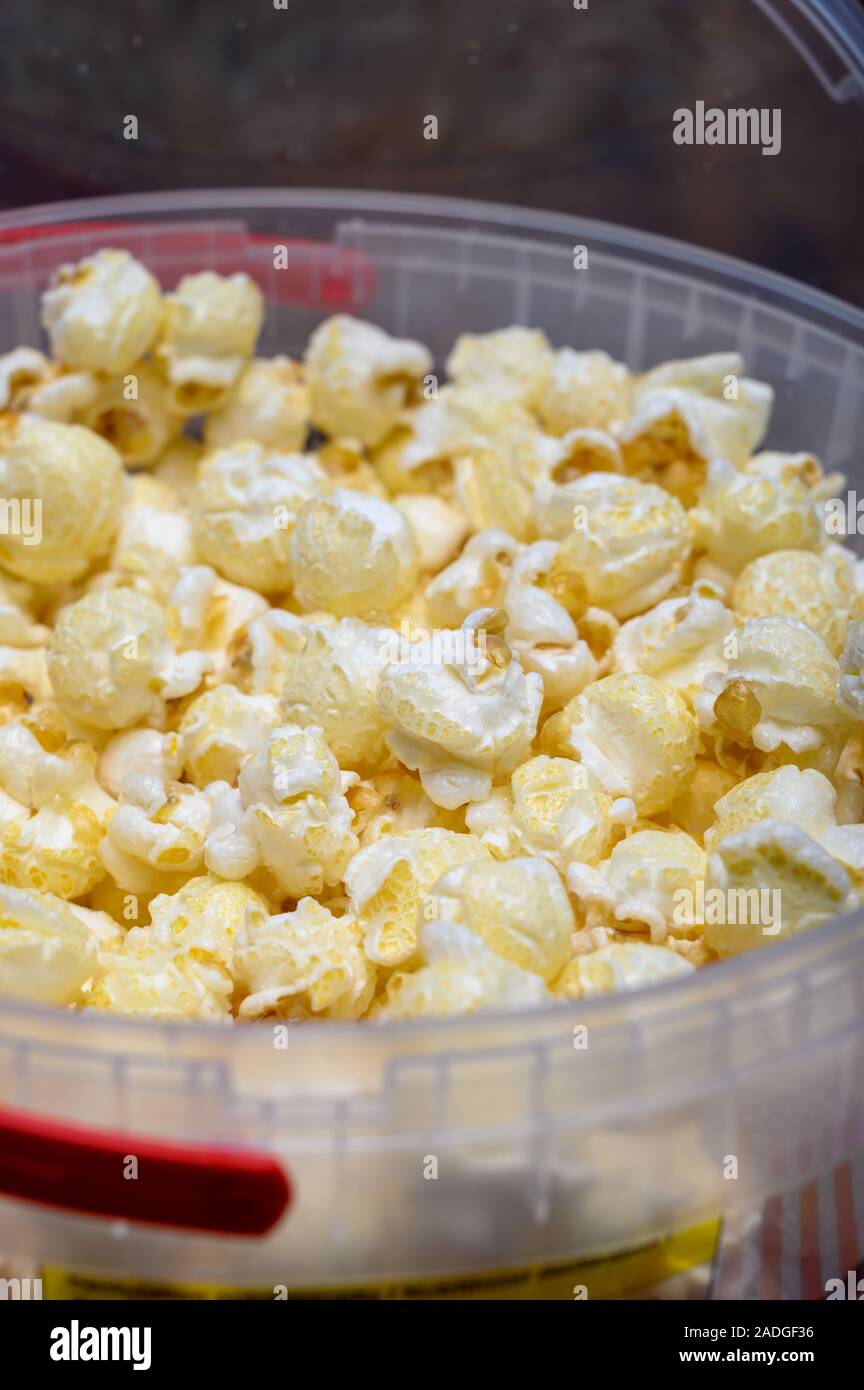Plastic bucket with tasty sweet popcorn ready to eat Stock Photo - Alamy