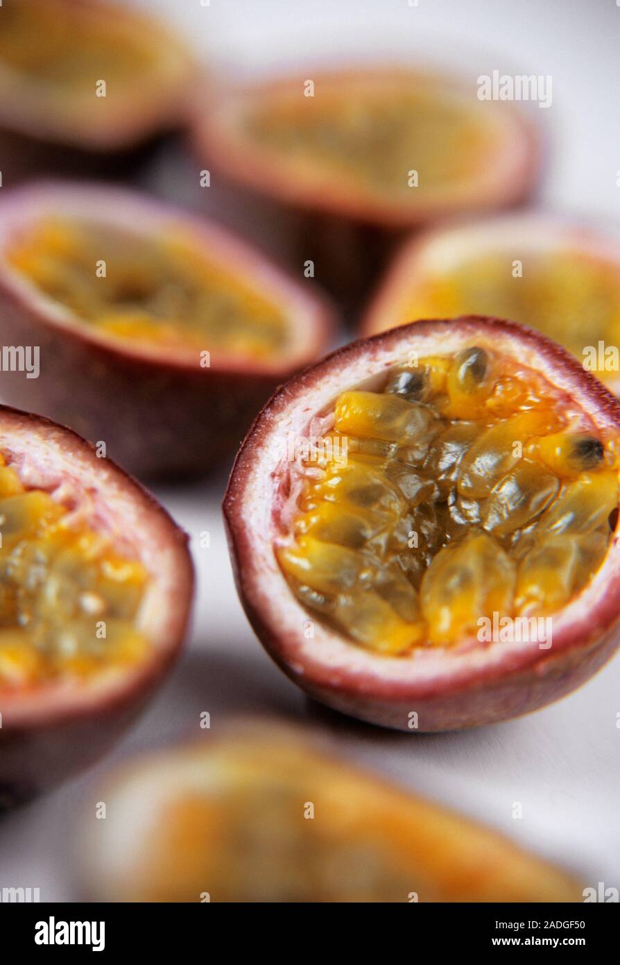 Passion fruit halves (Passiflora edulis). This tropical fruit is native ...