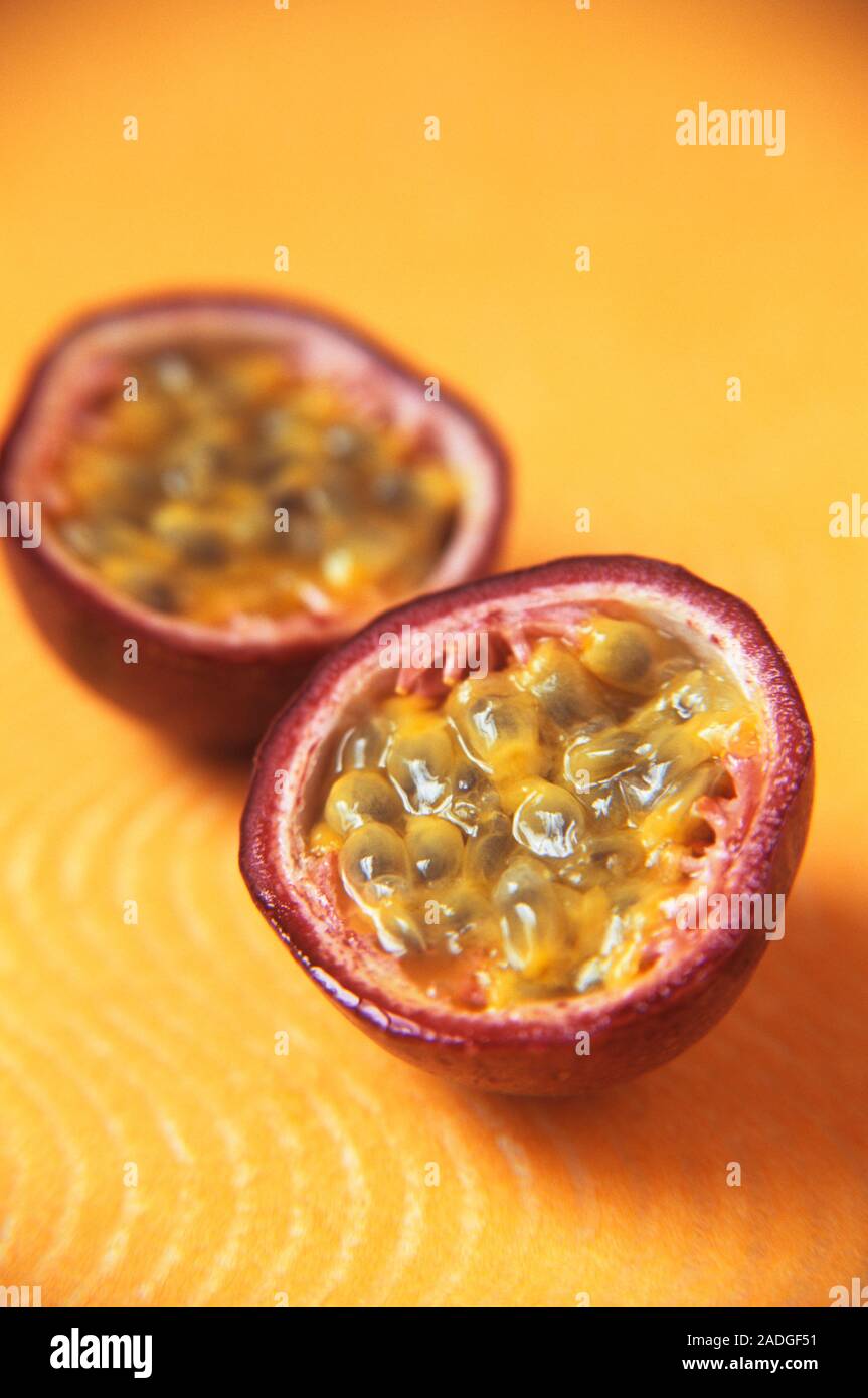 Passion fruit halves (Passiflora edulis). This tropical fruit is native ...
